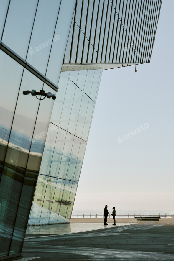 Modern Architecture with Reflection and Two Figures Present Stock Photo ...