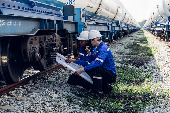 Engineer inspection and checking railway and checking work on railroad ...