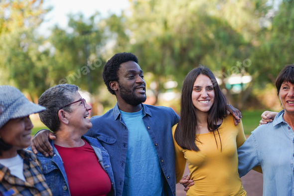 Group of happy multiracial people having fun hugging each other - Multi ...