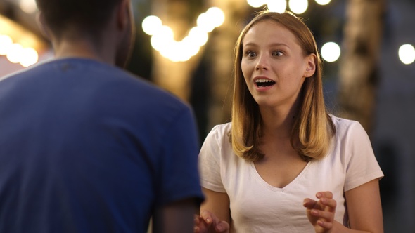 Cute girl telling a story to her friend with bright emotions., Stock ...