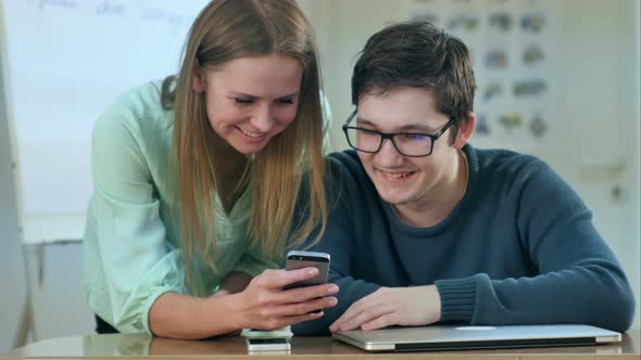 Two Young Students Using Phone During Class, Stock Footage | VideoHive