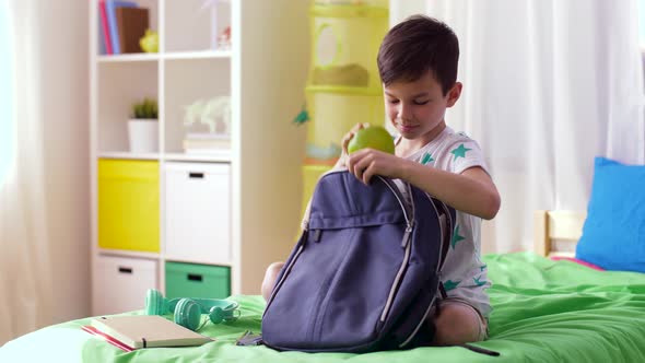 Boy Packing Schoolbag with School Supplies at Home 12, Stock Footage