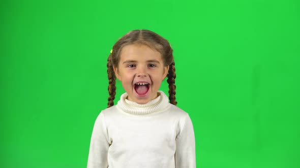 Cute Kid Screaming with Smile on Green Screen in Studio, Stock Footage