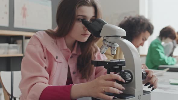 Girl Using Microscope, Stock Footage | VideoHive