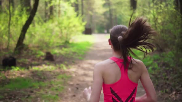 Active Woman Running in Spring Sunny Forest, Stock Footage | VideoHive