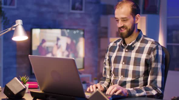 Bearded Software Engineer Laughing While Working Late Hours, Stock Footage