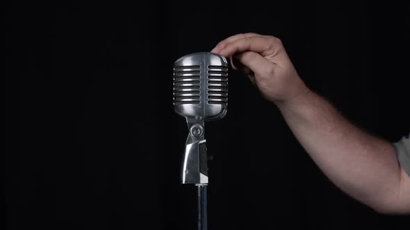 Person tapping microphone and speaking is this thing on, Stock Footage
