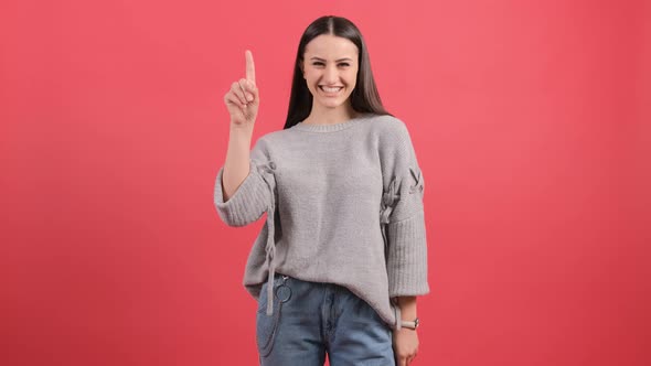 Young Woman Showing and Raising a Finger As a Sign of the Best Idea ...