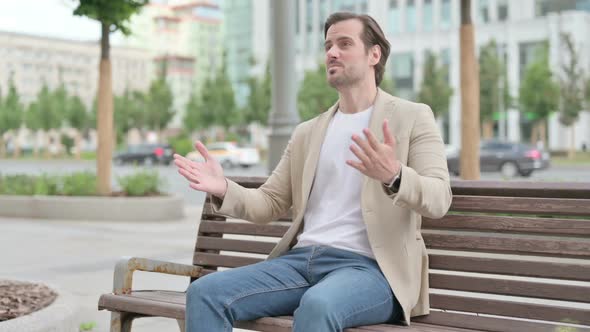 Tense Young Man Feeling Frustrated While Sitting on Bench, Stock Footage