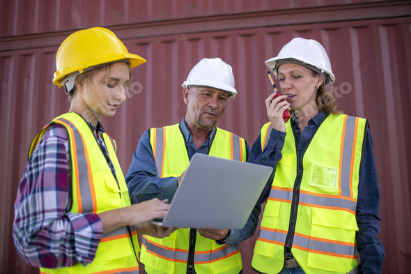 Engineer or dockworker working in the construction container dock yard ...