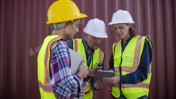 Engineer or dockworker working in the construction container dock yard ...