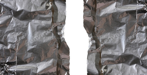 Crumpled sheet of gray foil for packaging products with torn edges on a ...