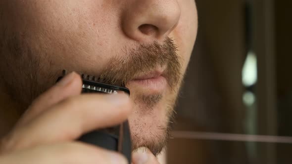 Close Up Man Shaving Mustache and Beard with an Electric Razor. , Stock ...