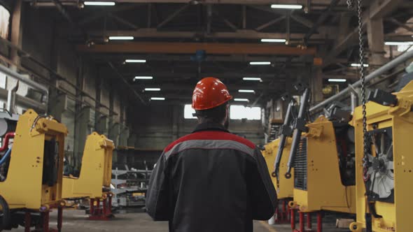 Workman Walking at Factory, Stock Footage | VideoHive