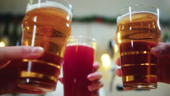 Toasting with Foamy Beer in Glasses Closeup, Stock Footage | VideoHive