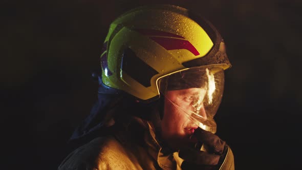 Portrait Shot of a Fireman in Action Speaking on the Walkie Talkie ...
