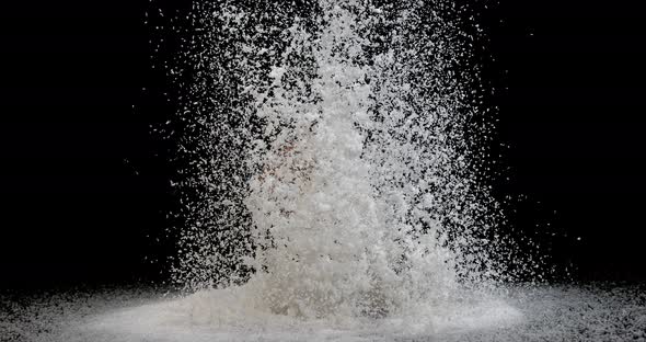 Coconut, cocos nucifera, Powder Exploding against Black Background ...
