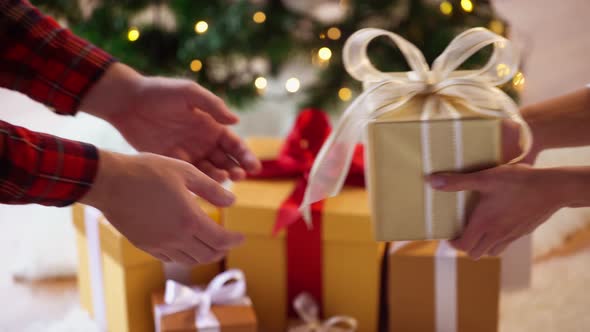 Hands Giving and Receiving Christmas Gift Box, Stock Footage | VideoHive