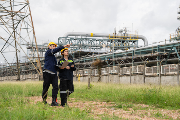 Engineer worker checking and survey at refinery petrochemical factory ...