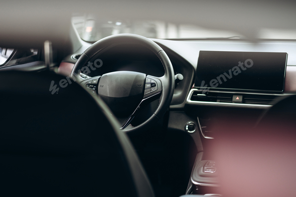 Close up view of the steering wheel of a luxury car. Steering wheel ...