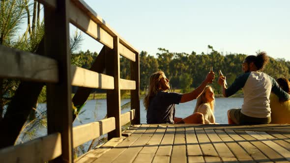 Friends sitting on stair and having fun in cabin 4k, Stock Footage