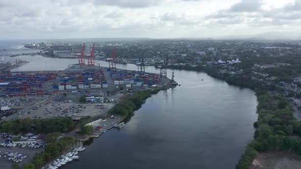 Haina Port Full of shipping containers and large cranes sitting on the ...