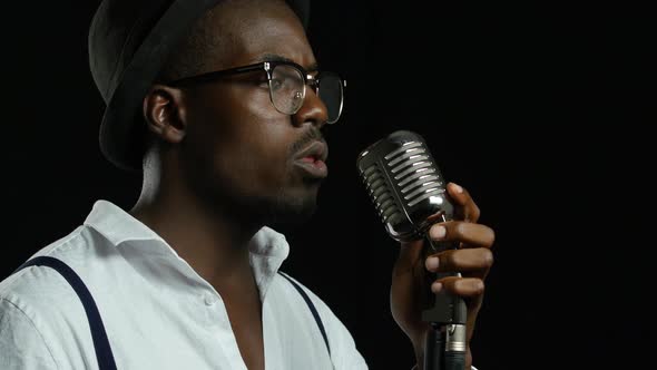 Singer in Half of the Turnover Sings Into a Retro Microphone and ...