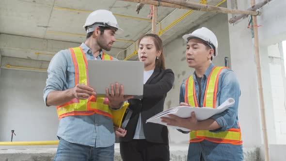 The engineering team working at building site meeting and discussing ...