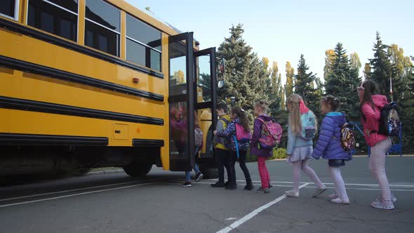 Elementary Age Students Entering School Bus, Stock Footage | VideoHive