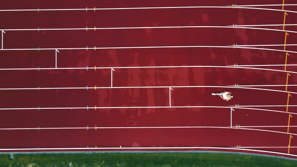Aerial Top View of Athlete Running at Marathon Stadium, Stock Footage