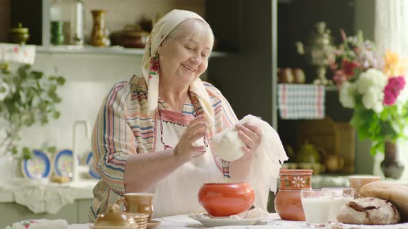 Babushka Senior Woman Cooking Cottage Cheese in Country, Stock Footage
