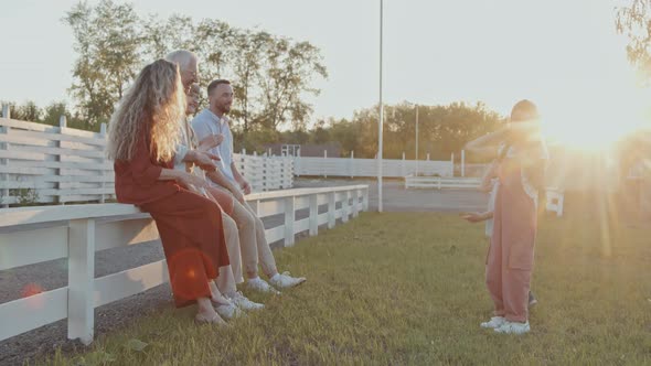 Family Watching Children Dancing Outdoors, Stock Footage | VideoHive