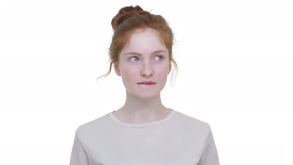 Caucasian Thoughtful Young Woman with Tied Ginger Hair in Topknot ...