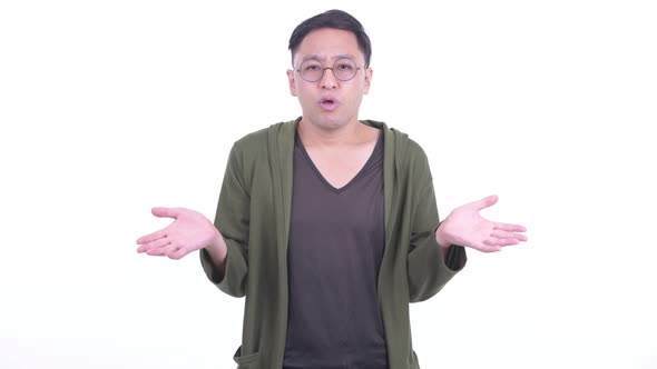 Confused Japanese Man with Eyeglasses Shrugging Shoulders, Stock Footage
