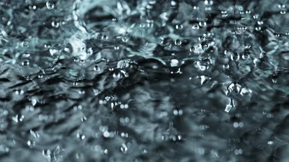 Super Slow Motion Shot of Many Water Drops Falling and Splashing on ...