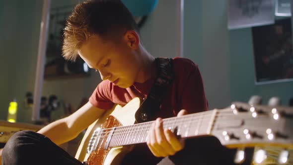 Teen Rocker Playing Guitar During Rehearsal in Bedroom, Stock Footage