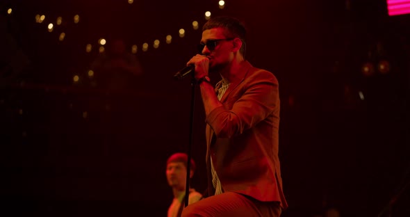 Portrait of Singer Man in Glasses Performing on Stage at Concert, Stock ...