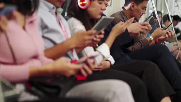 Young People Using Mobile Phone in Public Underground Train, Stock Footage