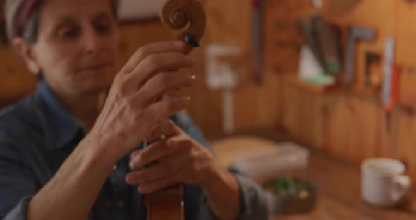 Female luthier at work in her workshop, Stock Footage | VideoHive