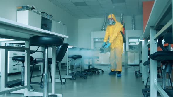 Sanitation Worker Sprays Laboratory Room. Covid19, Coronavirus Concept ...