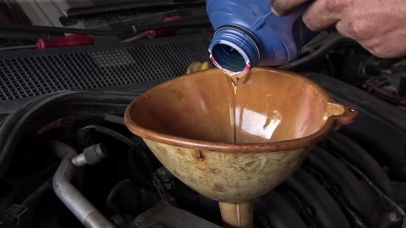 Filling The Oil Bottle To Engine Of The Car, Stock Footage | VideoHive
