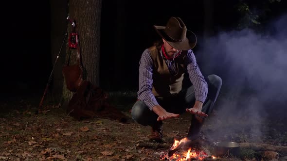 Cowboy Near the Fire in the Forest at Night, Stock Footage | VideoHive