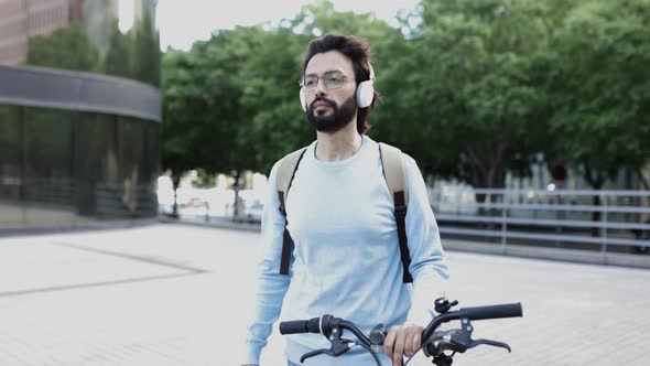 Young Hipster Commuter Man Walking with His Urban Bicycle in City ...