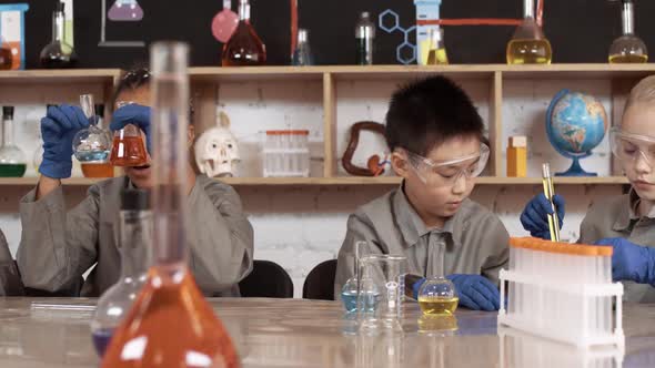 Laboratory Experience in a Chemistry Lesson Kids in Protective Glasses ...