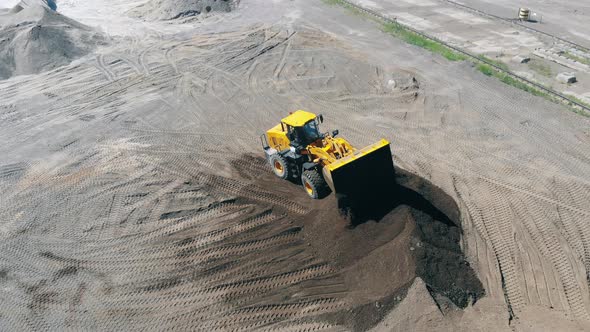 Boulder Quarry with an Excavator Transporting Ground Stones, Stock Footage