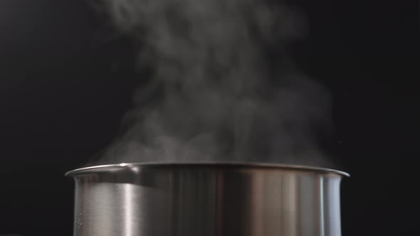 Steam Rising From Pot Over Black Background, Stock Footage | VideoHive