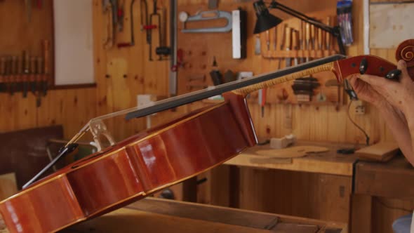 Female luthier at work in her workshop, Stock Footage | VideoHive