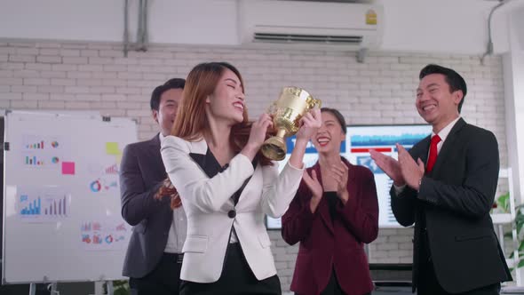 An employee of the company is proud to receive an award for a ...