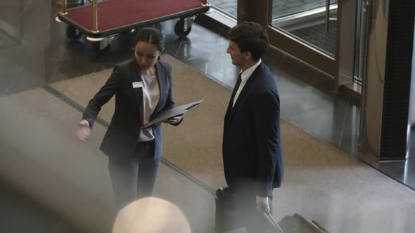 Female Hotel Greeter Meeting Guest, Stock Footage | VideoHive