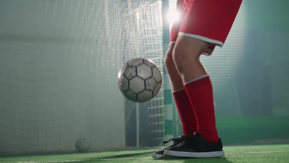 Slow Motion Young Football Player Performs Tricks with a Soccer Ball ...